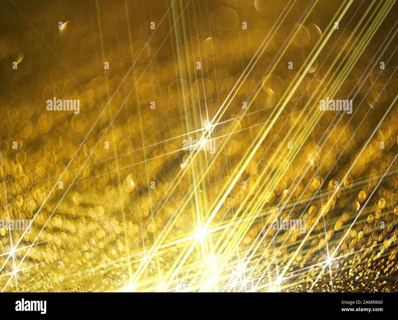 Diamond shine on a golden background Stock Photo - Alamy