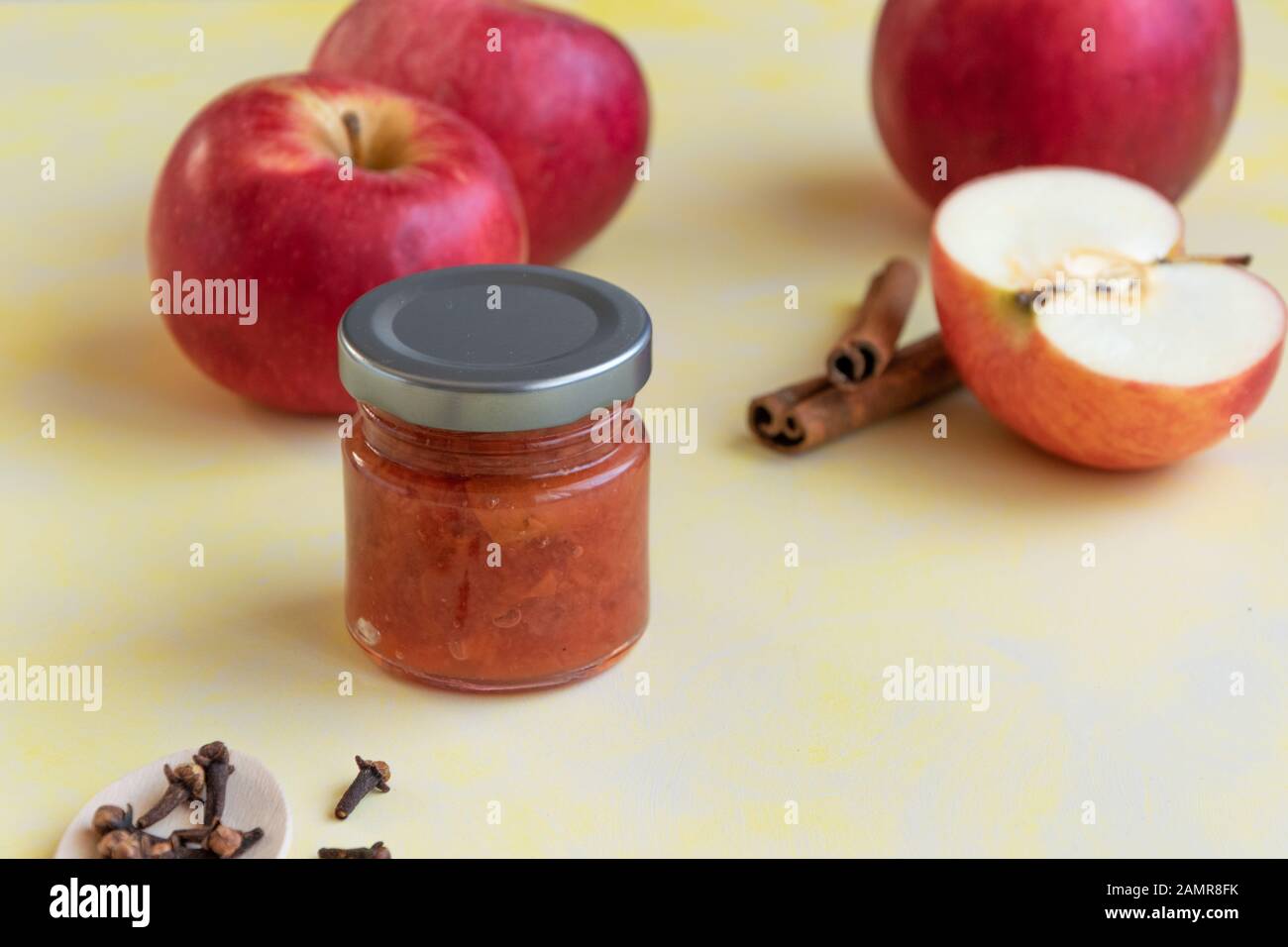 Homemade jam with red apples, cloves and cinamon Stock Photo - Alamy