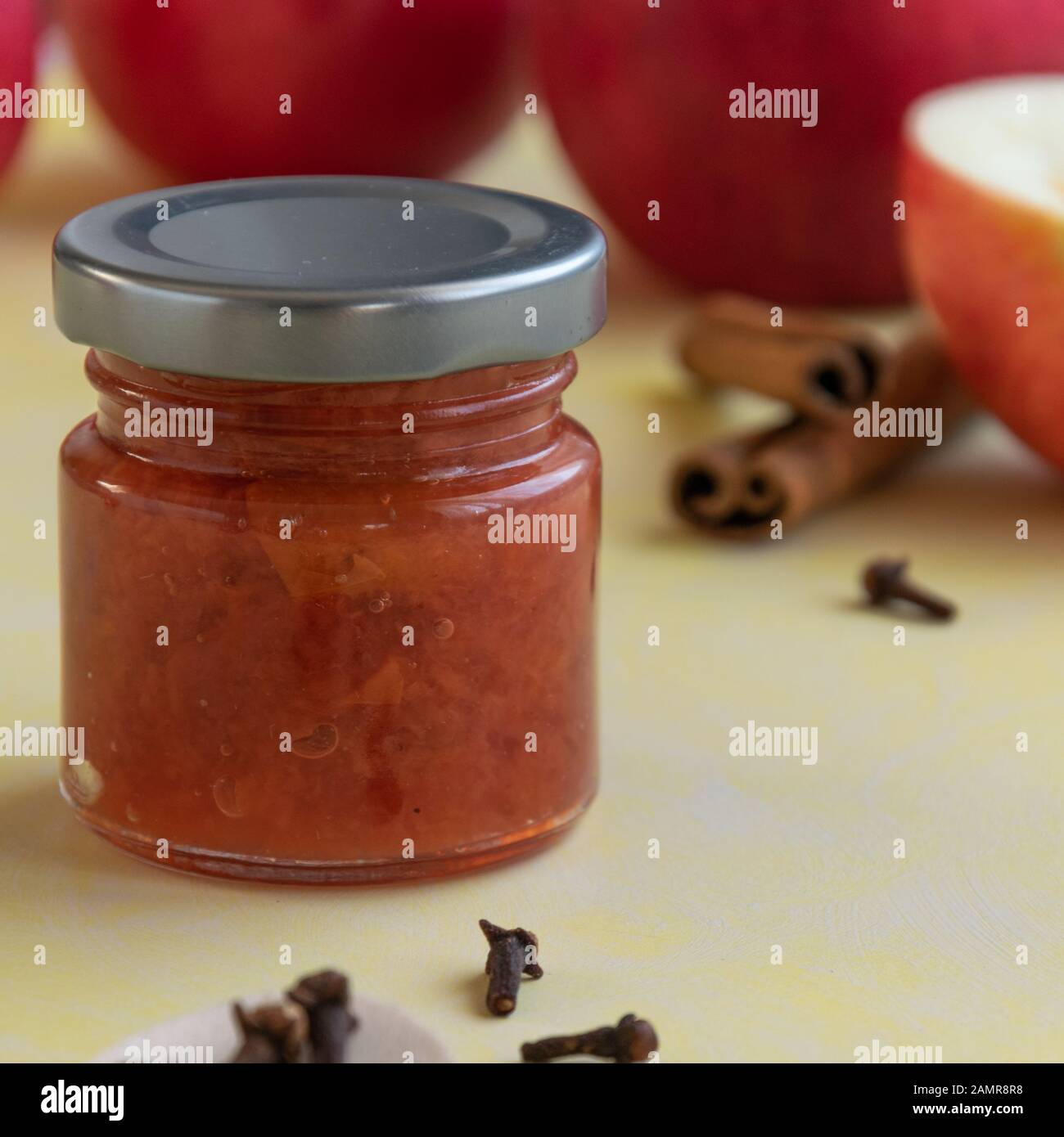 Homemade jam with red apples, cloves and cinamon Stock Photo - Alamy