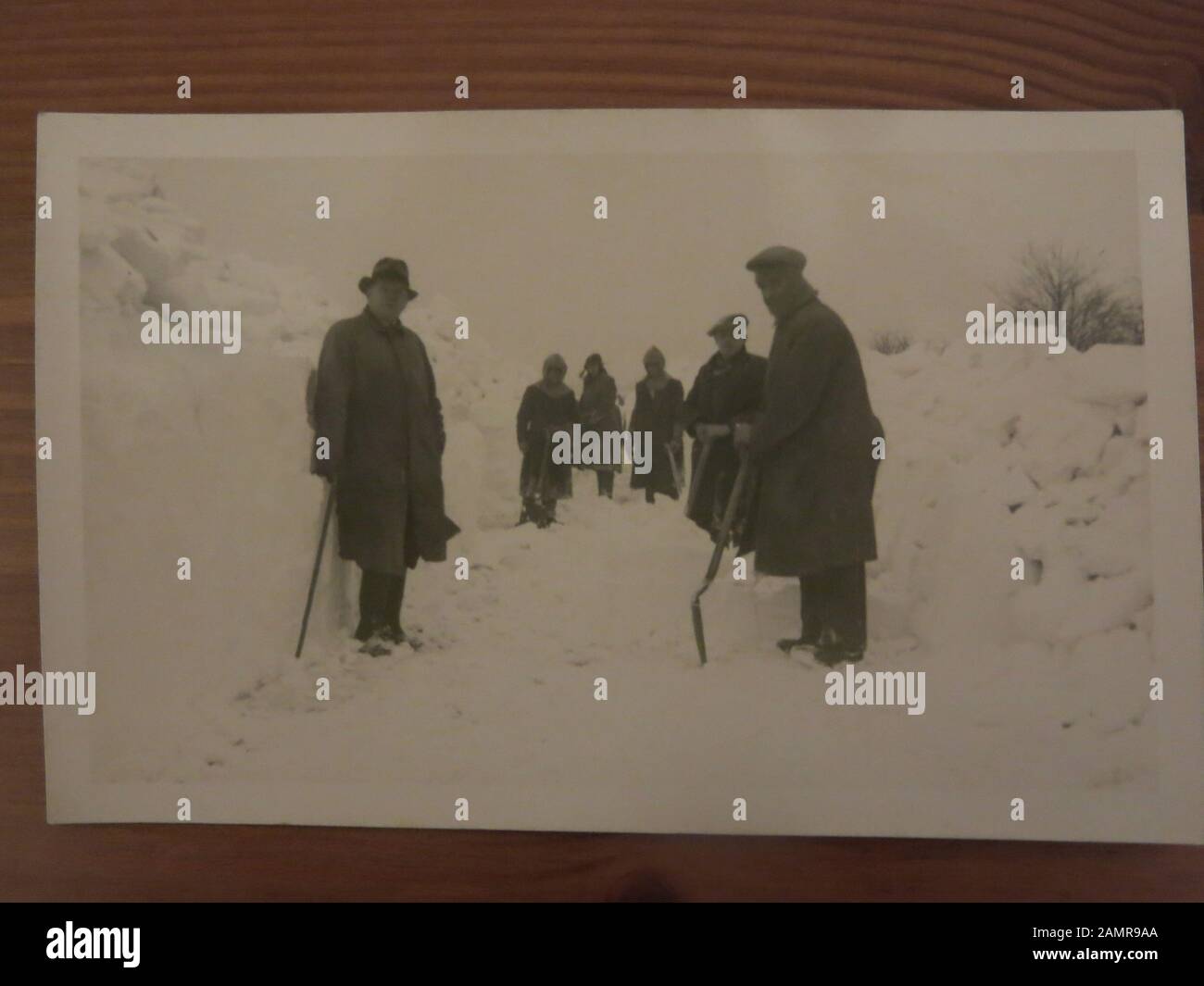 Copy of an old photograph of the Big Snow of 1947 showing men with ...