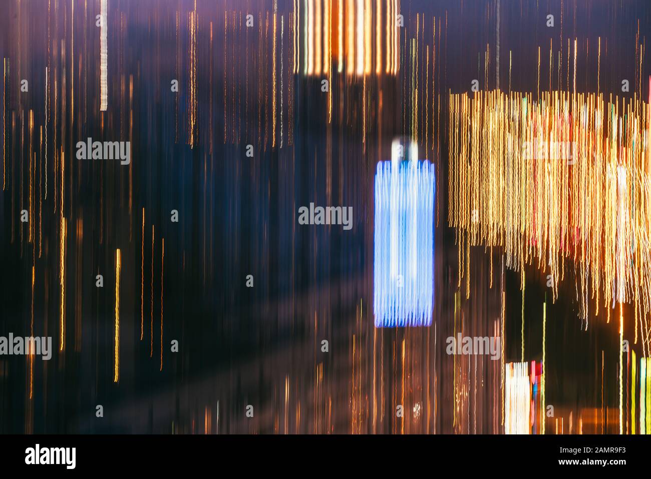 many glowing windows of the night city buildings. Motion blur long ...