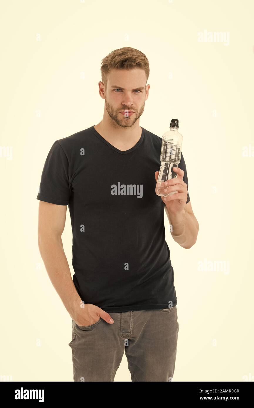 Stay hydrated. Man athletic sportsman hold bottle water. Man casual ...