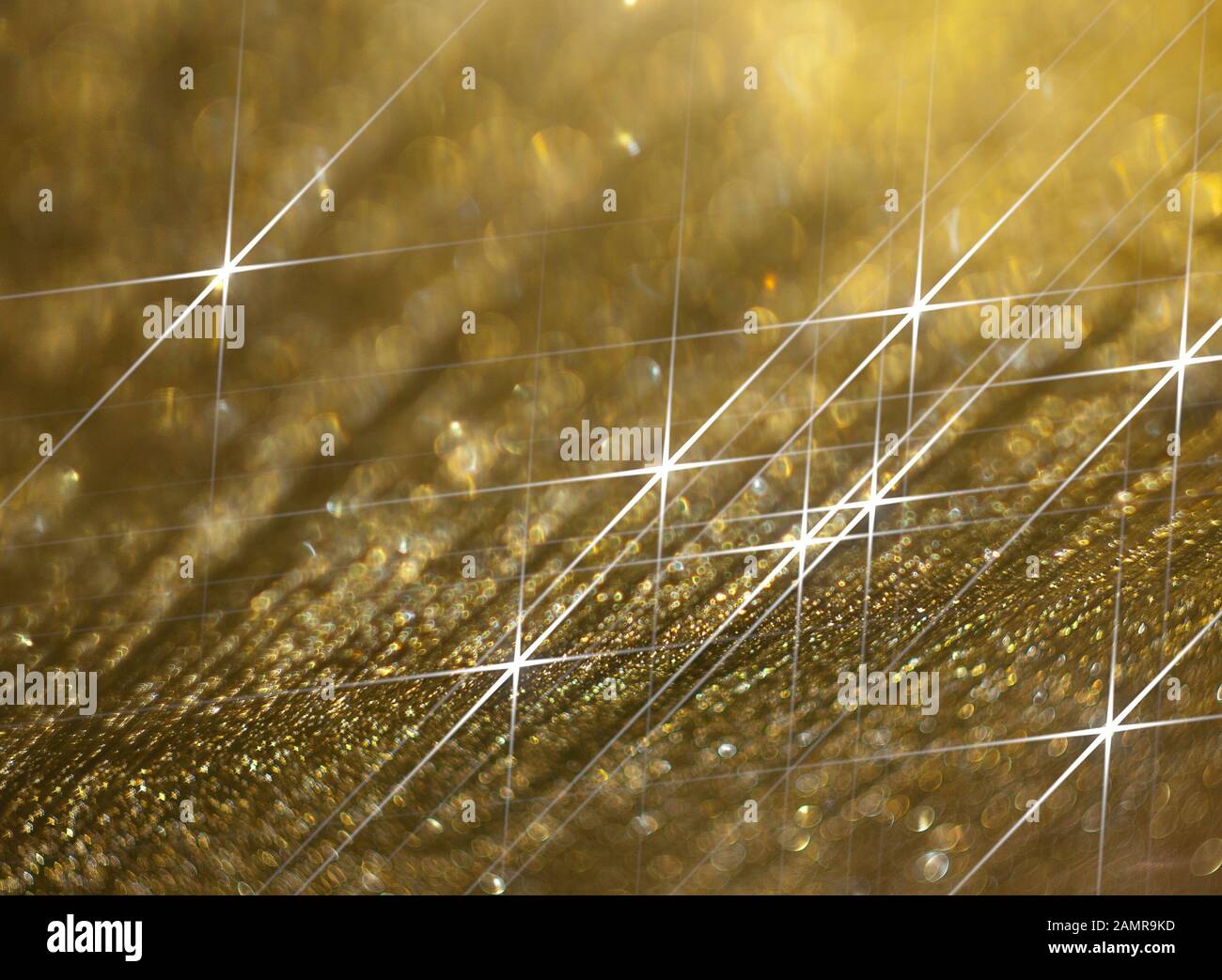 Diamond shine on a golden background Stock Photo - Alamy