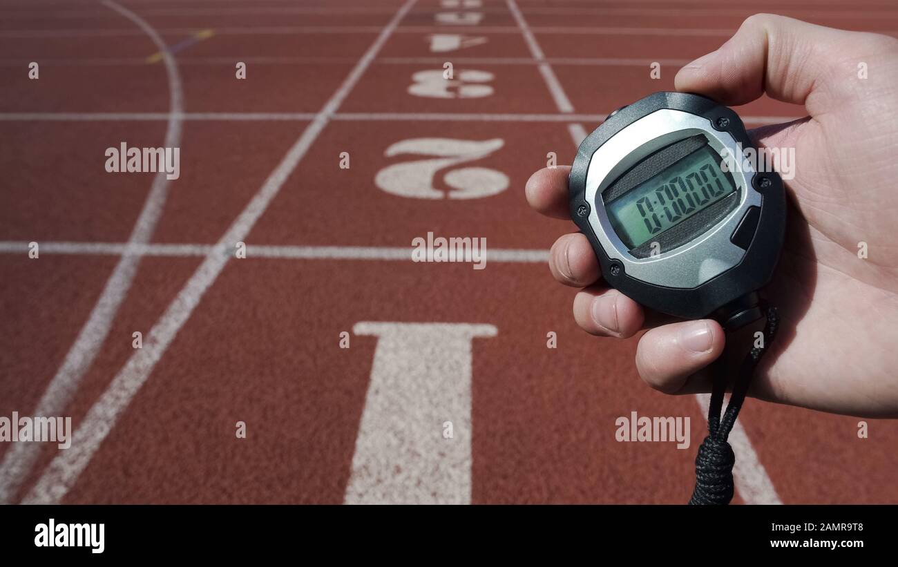 Male hand holding stopwatch with zero time, new life stage beginning ...