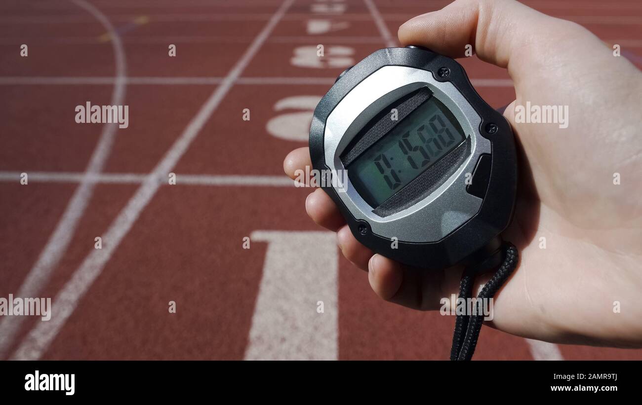 Hand holding stopwatch with time 15 seconds, bad result, failure in ...