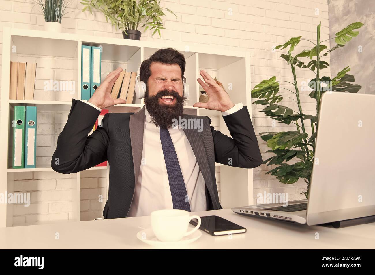 Motivational music. Successful businessman. Man office worker listening ... Motivational music. Successful businessman. Man office worker listening ...