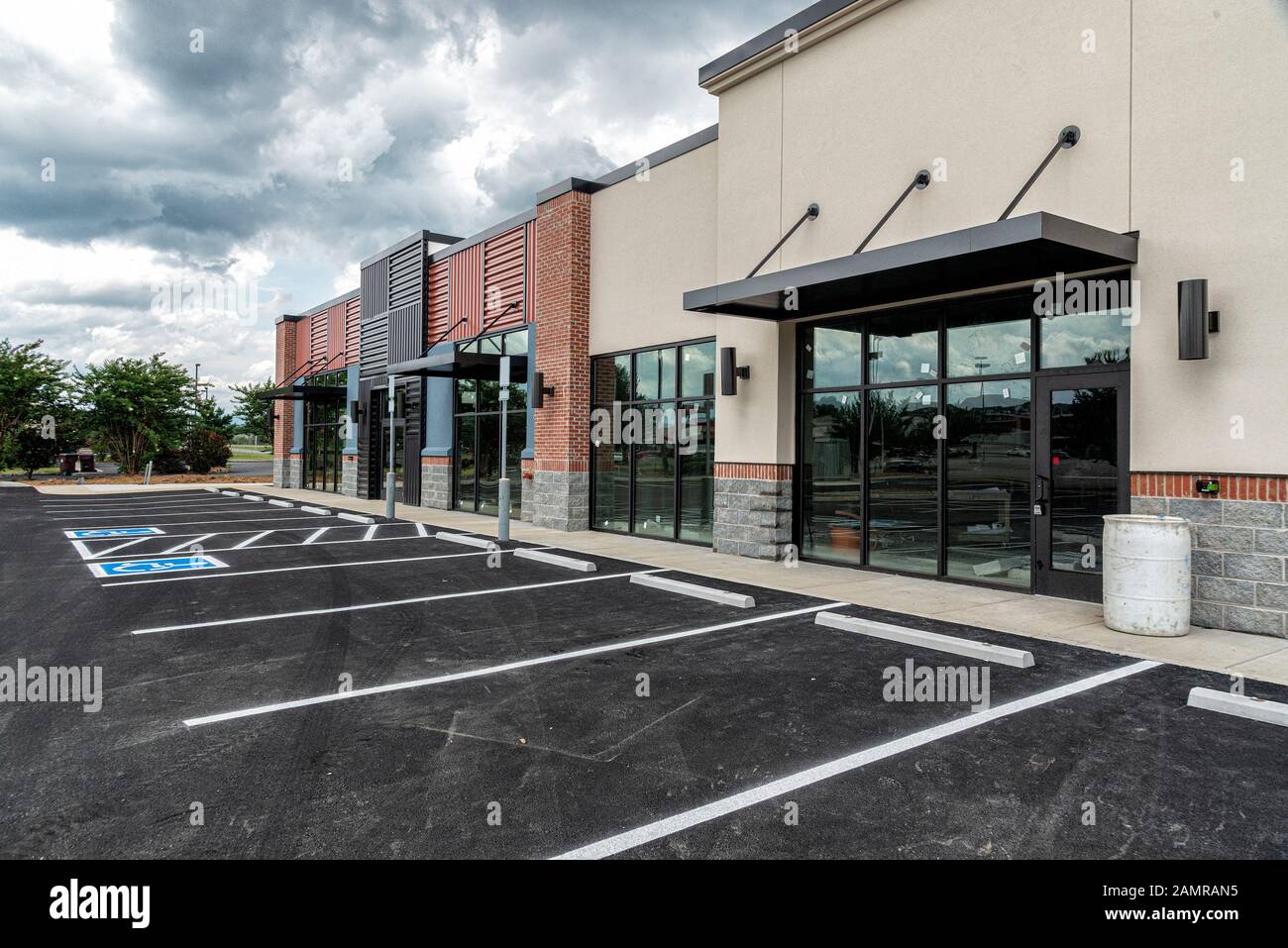 Horizontal shot of a new strip shopping center nearing completion Stock Photo - Alamy