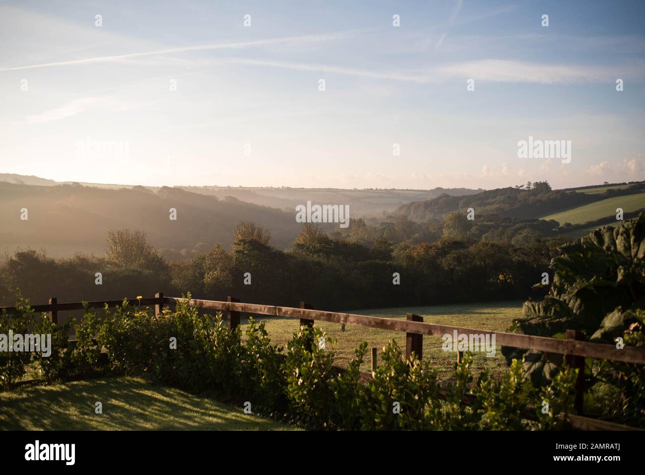 View from garden in Helston, Cornwall across valleys with sunshine and ...
