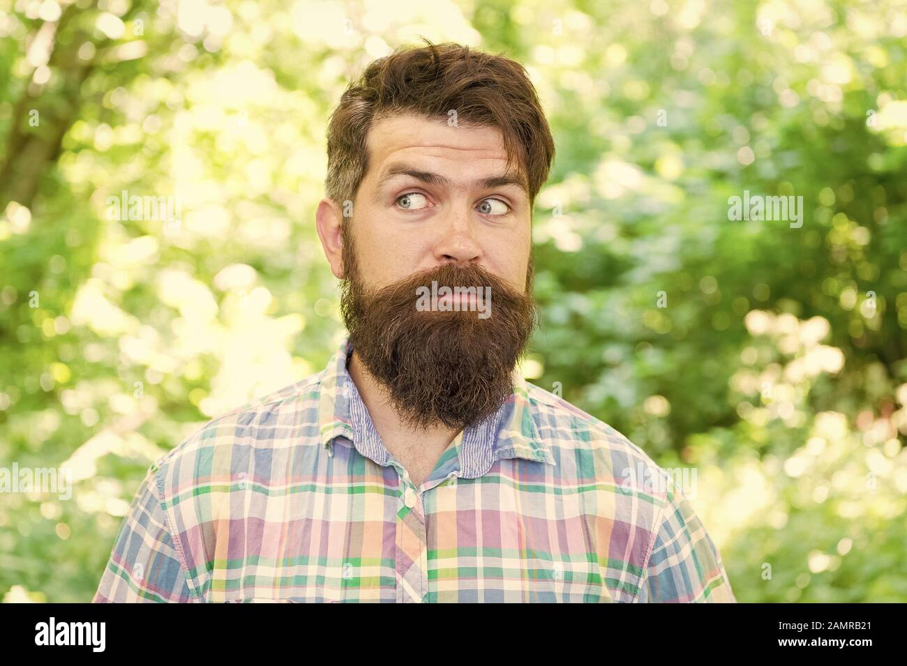 Handsome lumberjack. Man beard and mustache in summer forest. Summer ...
