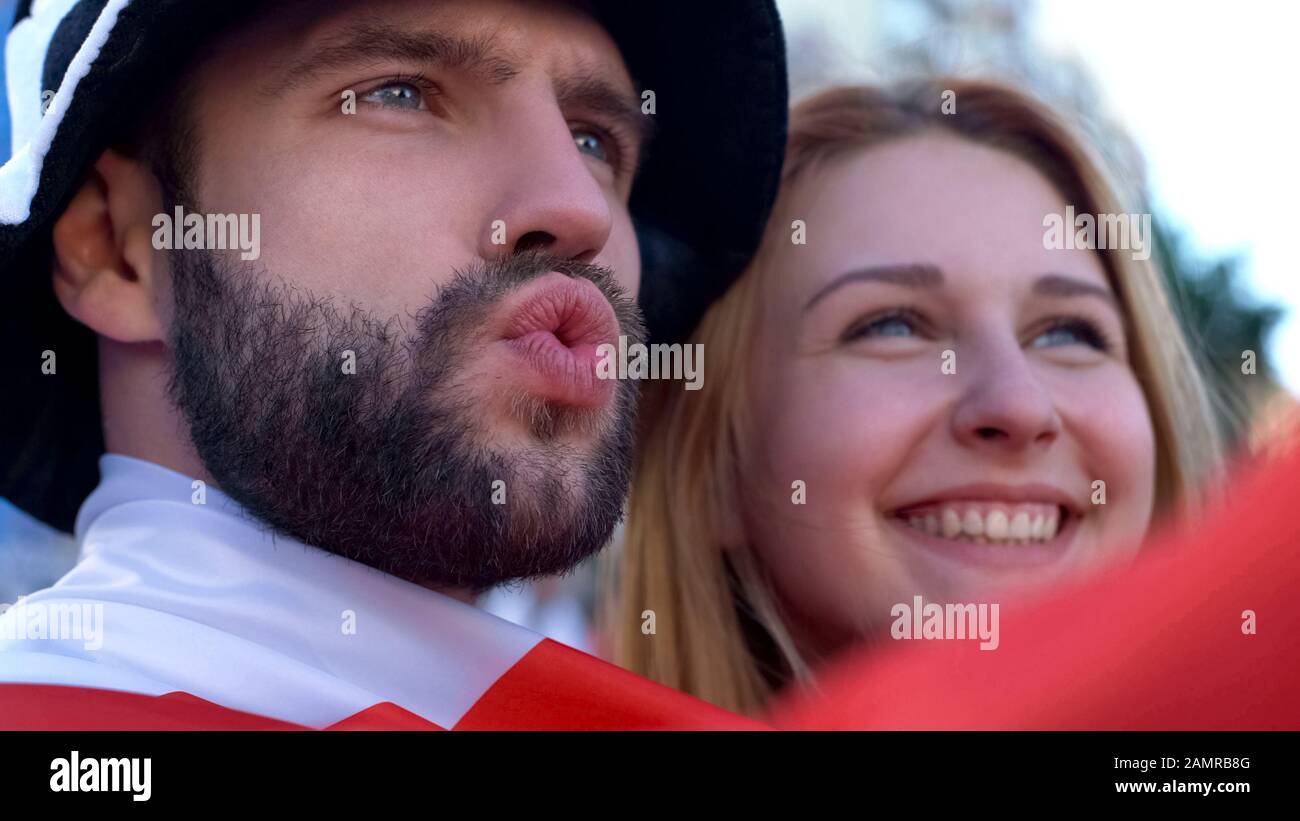 Happy football fans couple chanting and rejoicing goal of favorite team ...