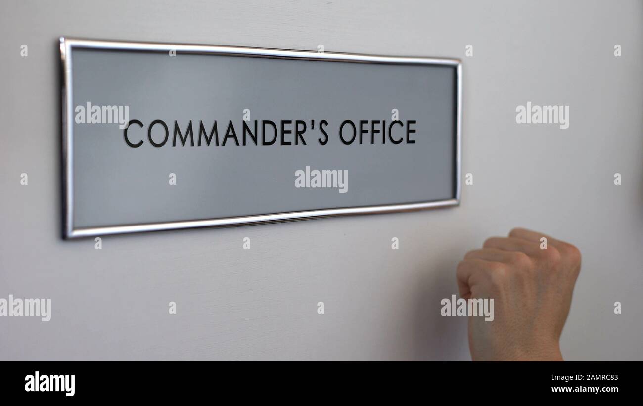 Commander office door, hand knocking closeup, military authority ...