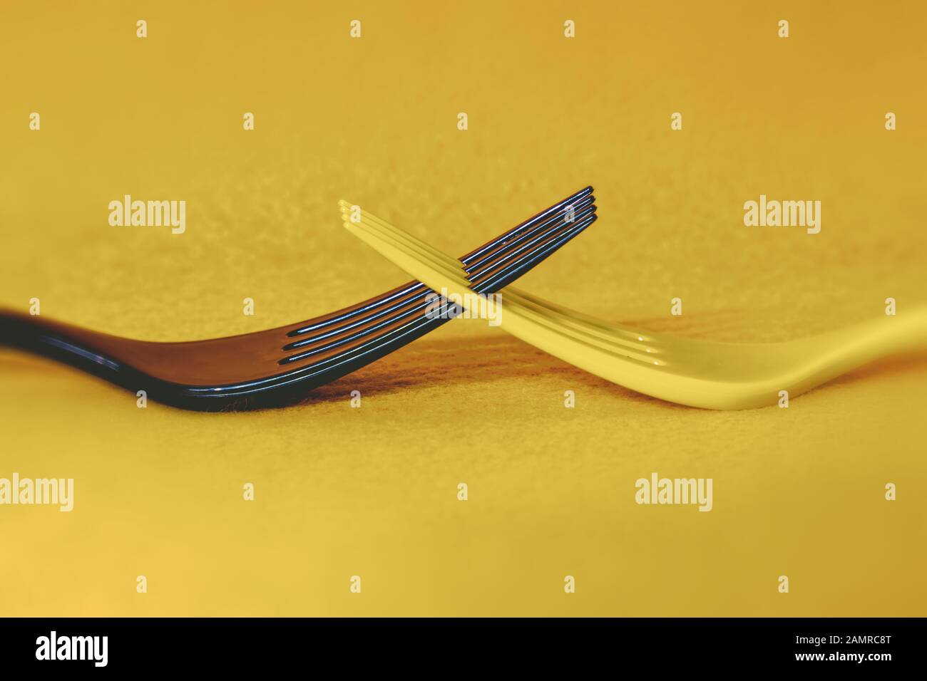 Concerpt diversity and inclusion, black and yellow fork Stock Photo - Alamy