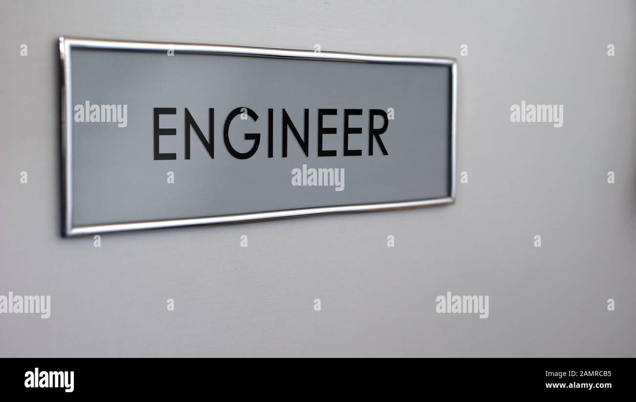 Engineer office door desk closeup, housing estate development project ...