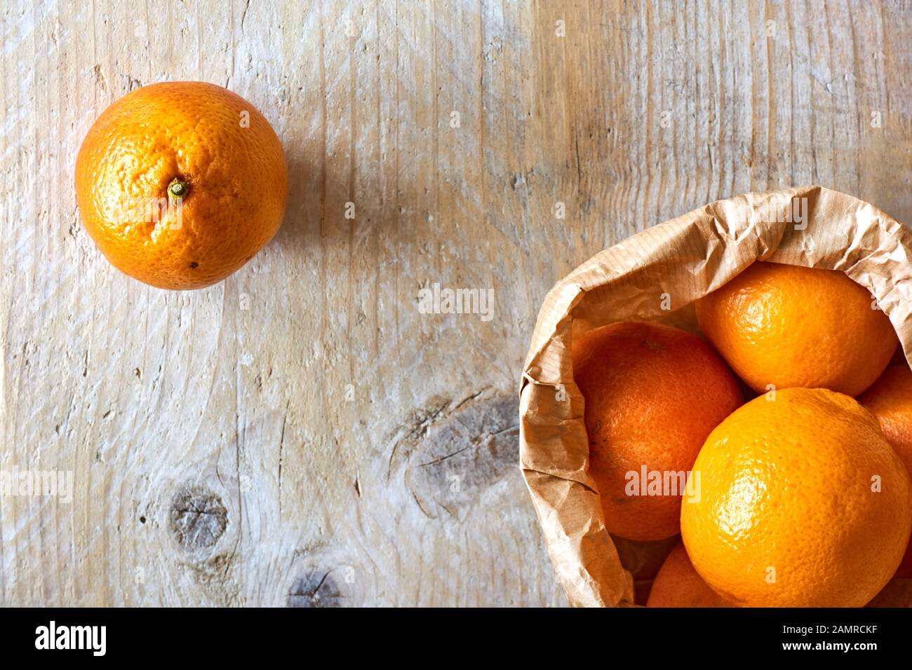 Orange organic blood oranges in brown paper bag on weathered wooden ...