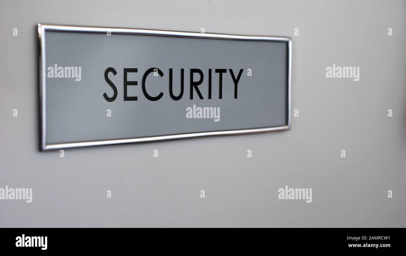 Security office door desk closeup, surveillance system, access ...
