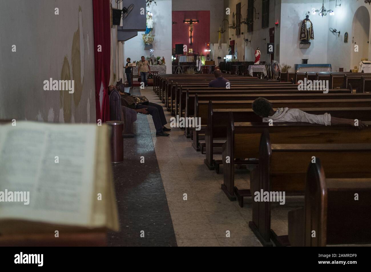 Homeless people sleep inside catholic church in downtown Rio de Janeiro ...