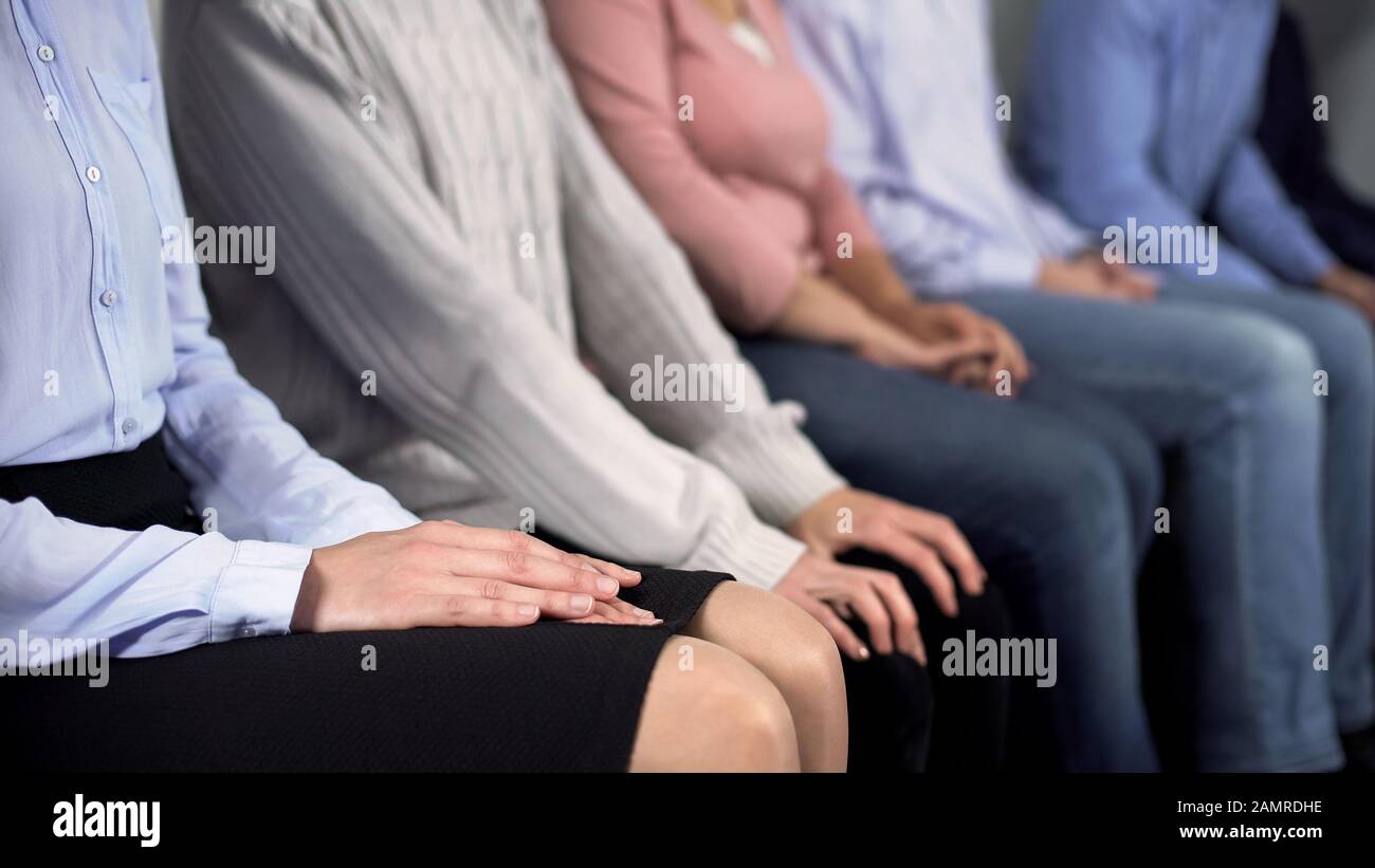 Anxious people waiting in queue at hospital, stressful moments, bad ...