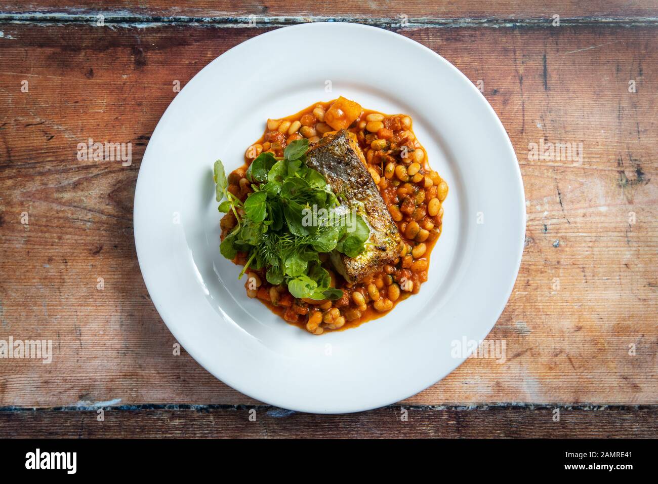 Hake with cannellini bean, chorizo and crab bisque stew with mini ...