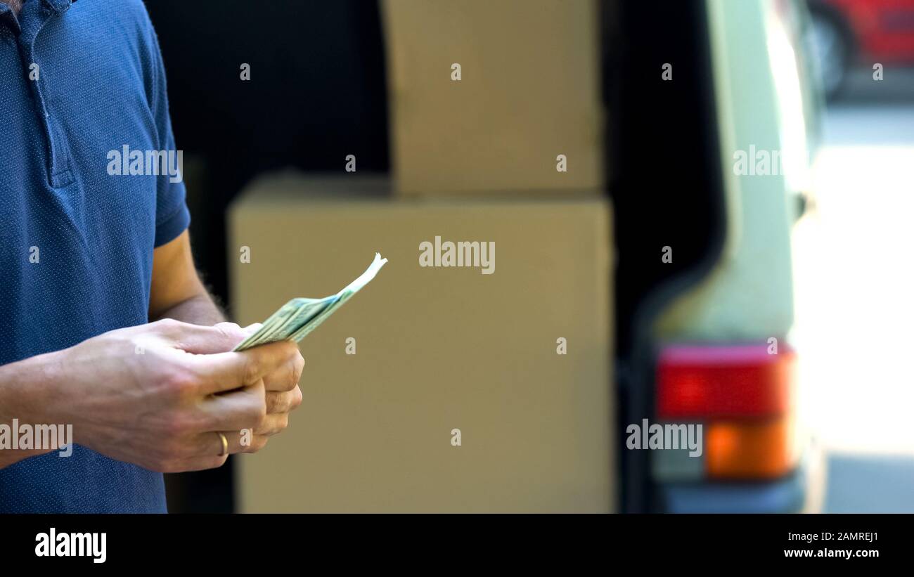 Man transporting parcel hi-res stock photography and images - Alamy