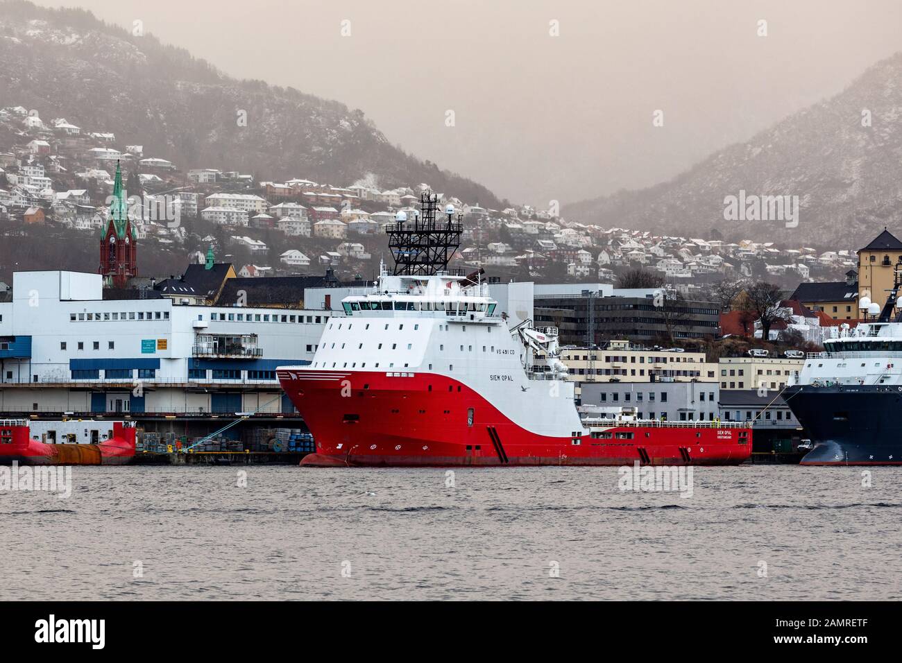 Offshore AHTS anchor handling vessel Siem Opal at Dokken quay. Snow ...