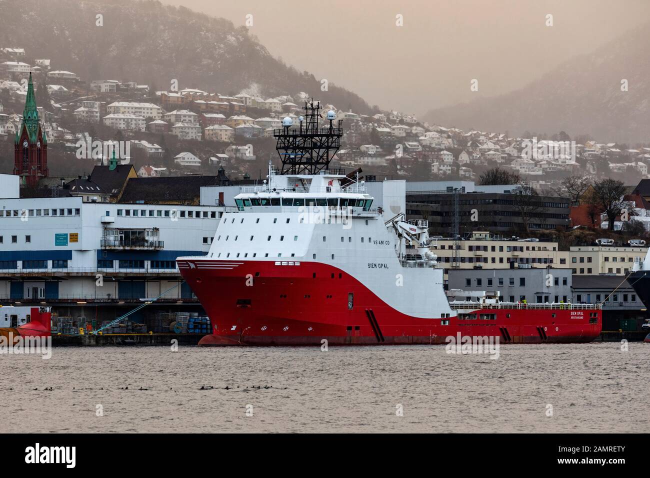 Offshore AHTS anchor handling vessel Siem Opal at Dokken quay. Snow ...