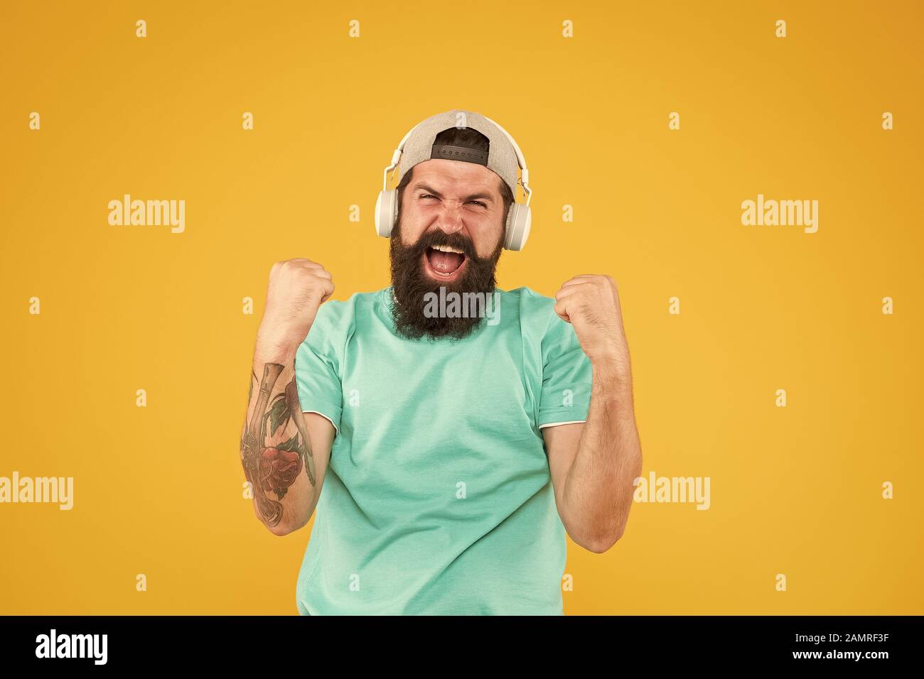 He isnt nothing but a winner. Happy hipster shouting and making winner ...