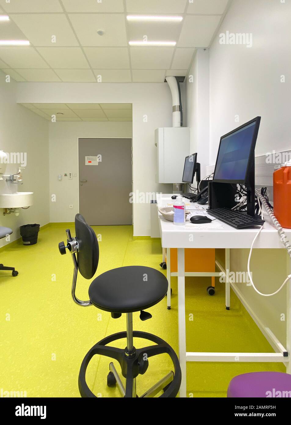 Interior view of modern hospital facility room with two computers and ...