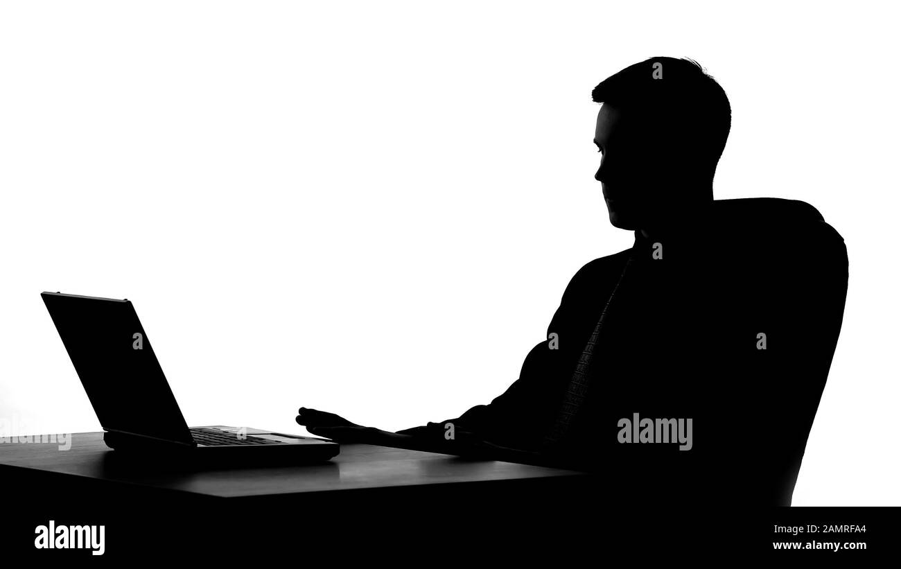 Office worker shadow sitting in front of laptop, thinking on business ...