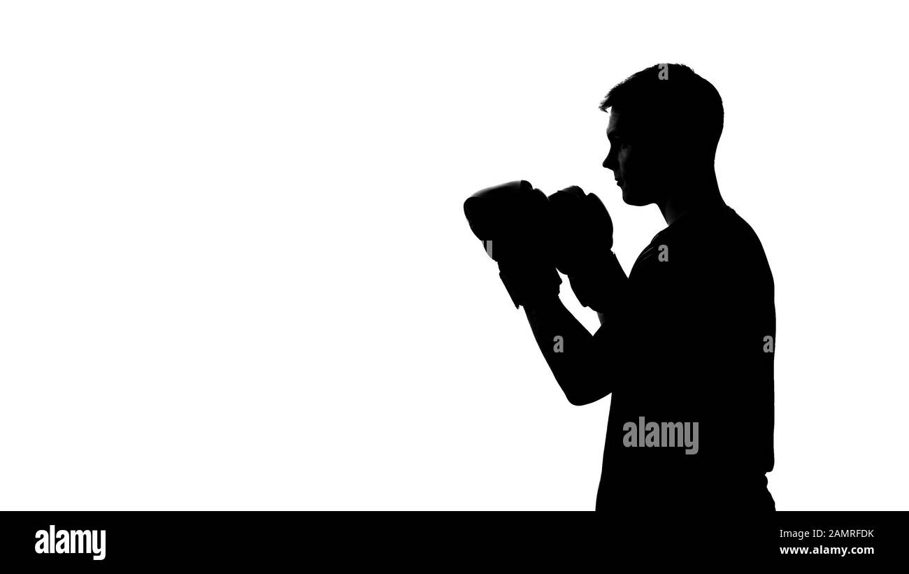 Sportsman silhouette training in gym, shadow boxing, practicing for ...