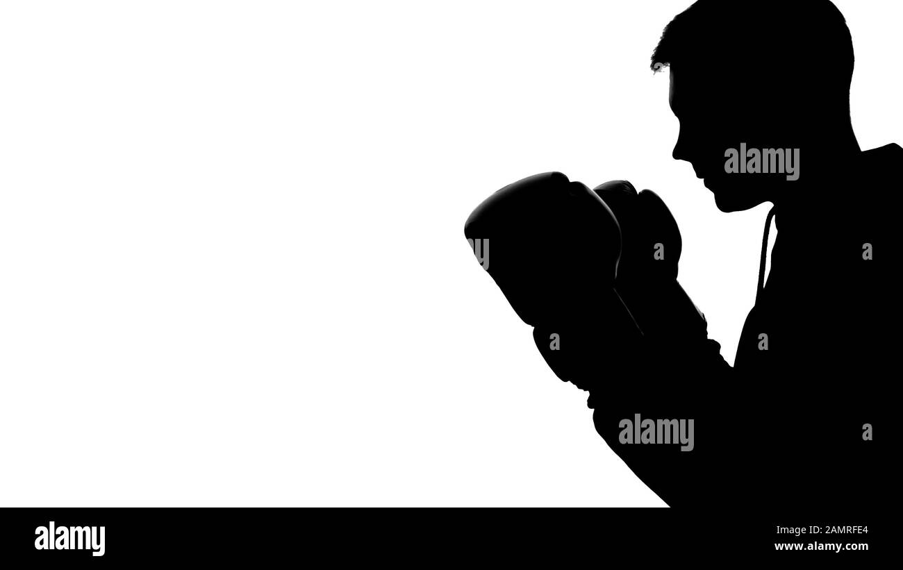 Silhouette of athletic person in sports suit training in gym, shadow ...