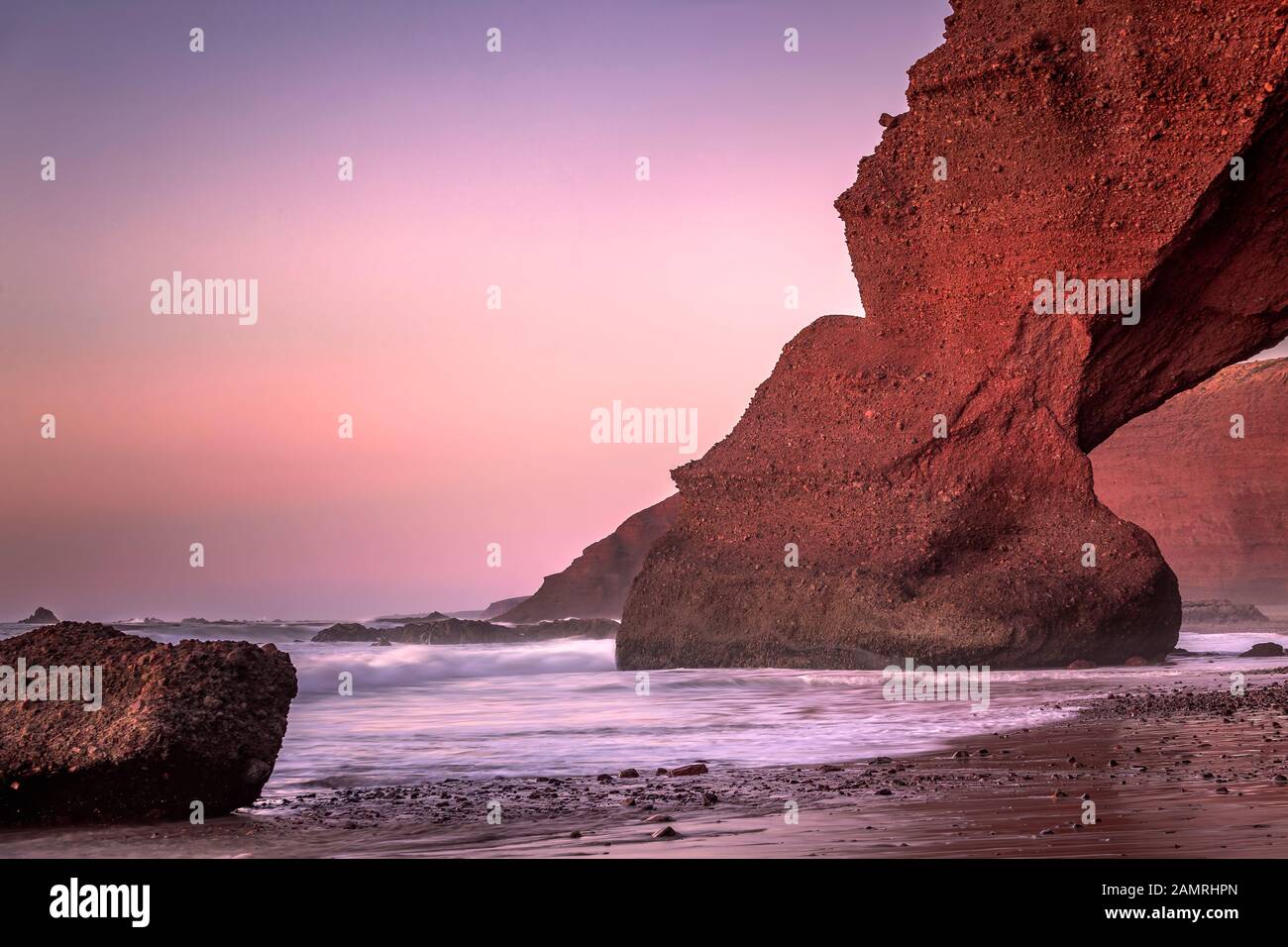 Sunset at red arches of Legzira beach, Sidi Ifni, Souss-Massa-Draa ...