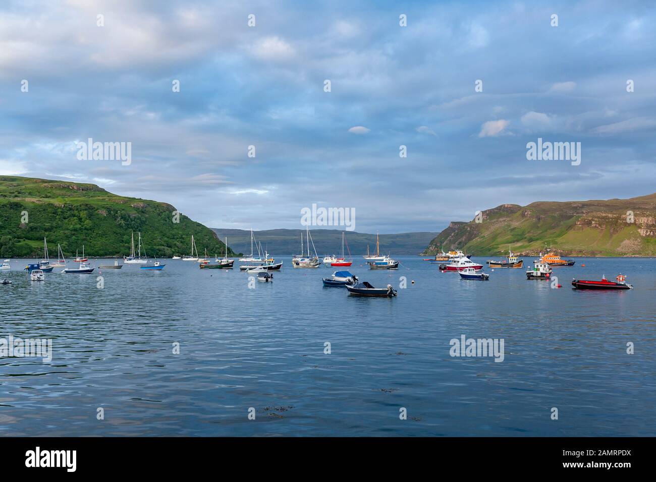 Sunset over the harbor in Portree, Isle of Skye, Scotland Stock Photo ...