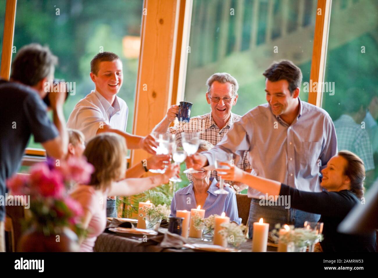 Family making a toast at the dinner table Stock Photo - Alamy