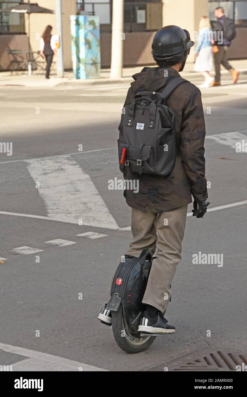 Ecological transport. modern futuristic electric unicycle in motion ...