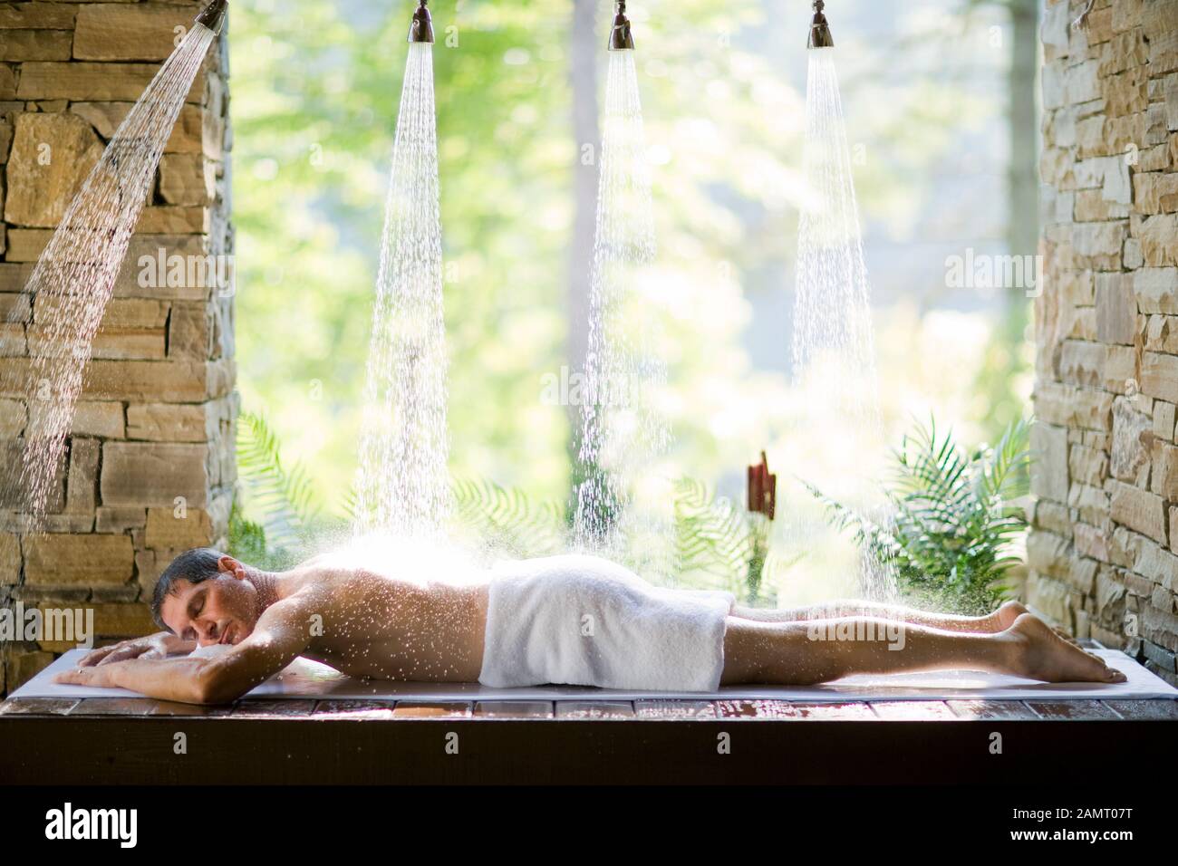 Man having a Vichy shower Stock Photo - Alamy
