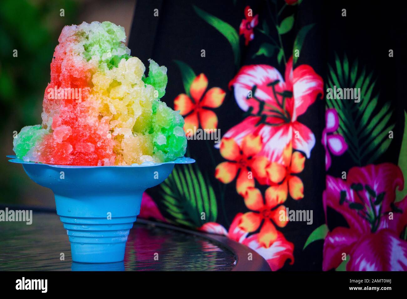 Strawberry, pineapple and lime flavored Hawaiian shave ice in a cup is ...