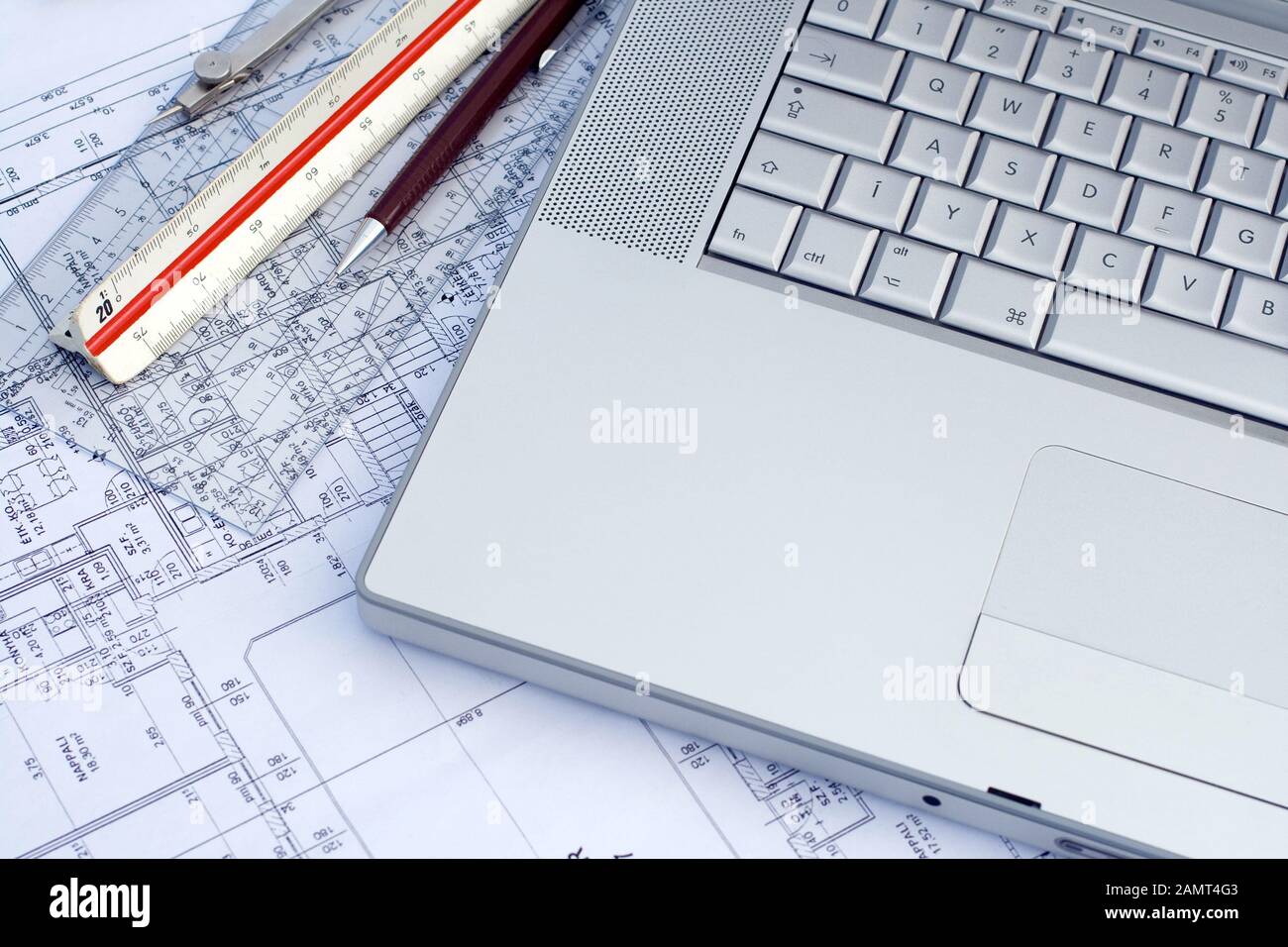 Laptop, rulers and pens on a floor map Stock Photo - Alamy