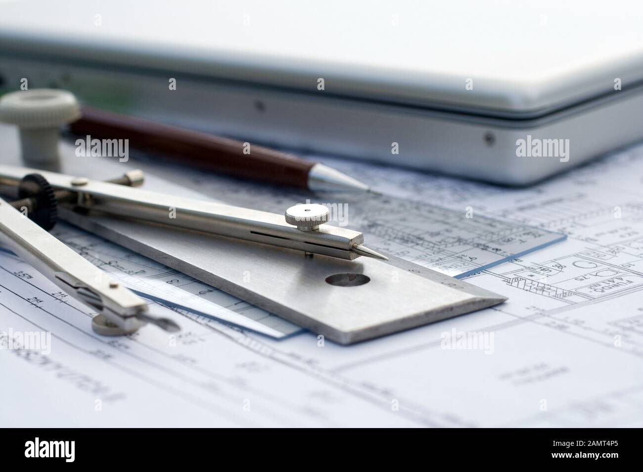 Laptop, rulers and pens on a floor map Stock Photo - Alamy