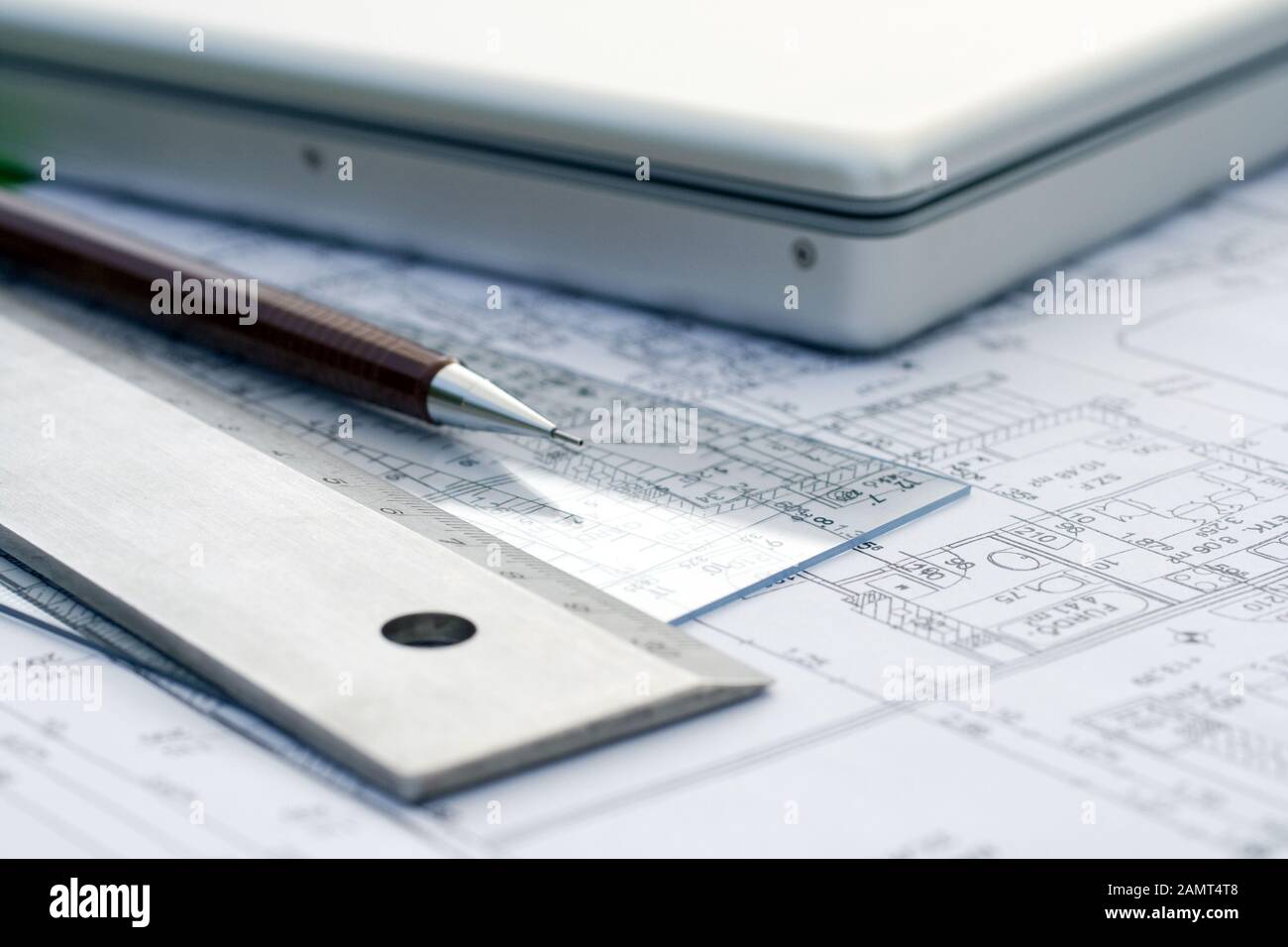 Laptop, rulers and pens on a floor map Stock Photo - Alamy