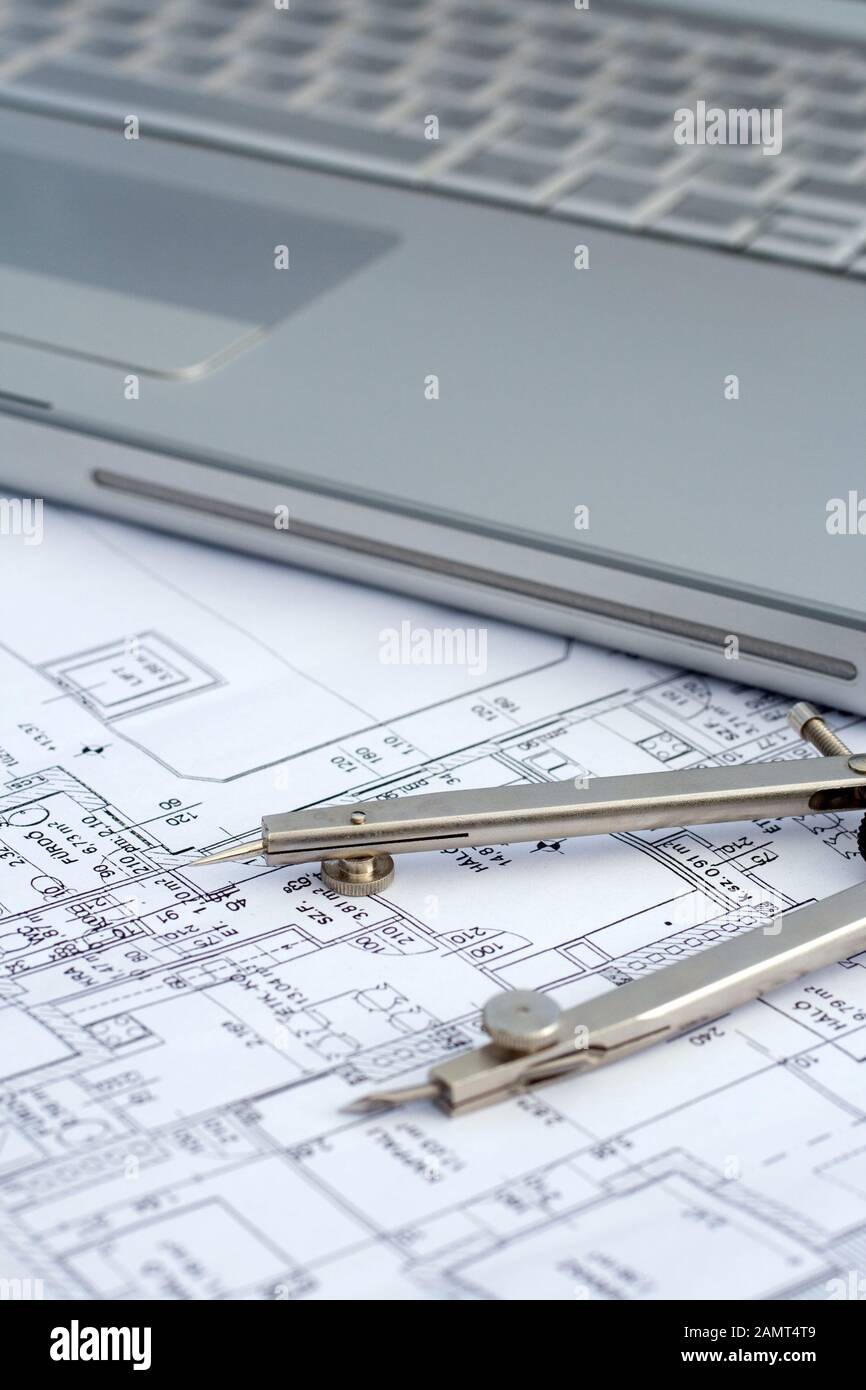 Laptop, rulers and pens on a floor map Stock Photo - Alamy