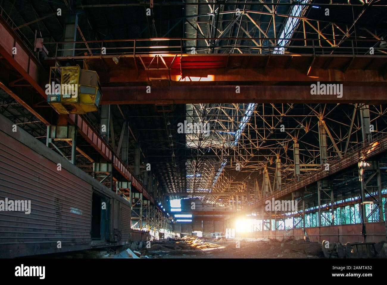 Abandoned ruined large industrial building with garbage waiting for ...
