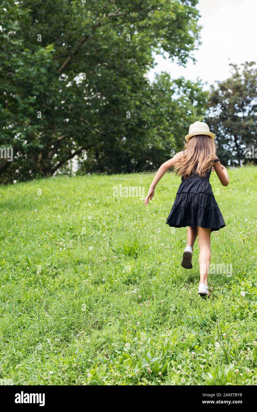 Children Running Through Meadow High Resolution Stock Photography and ...