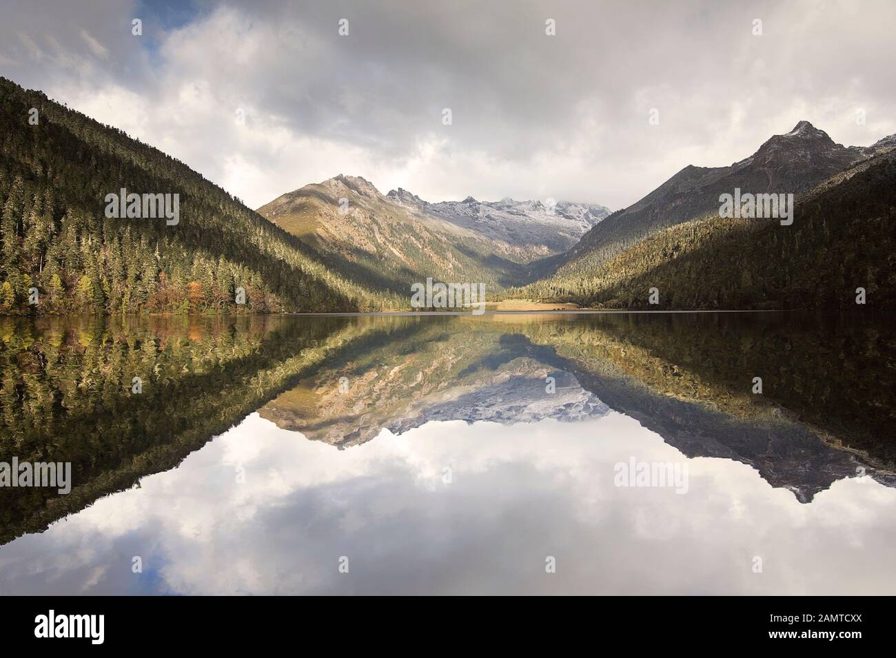 Mountain reflections in Wuxu Hai Lake, Jiulong County, Sichuan, China ...