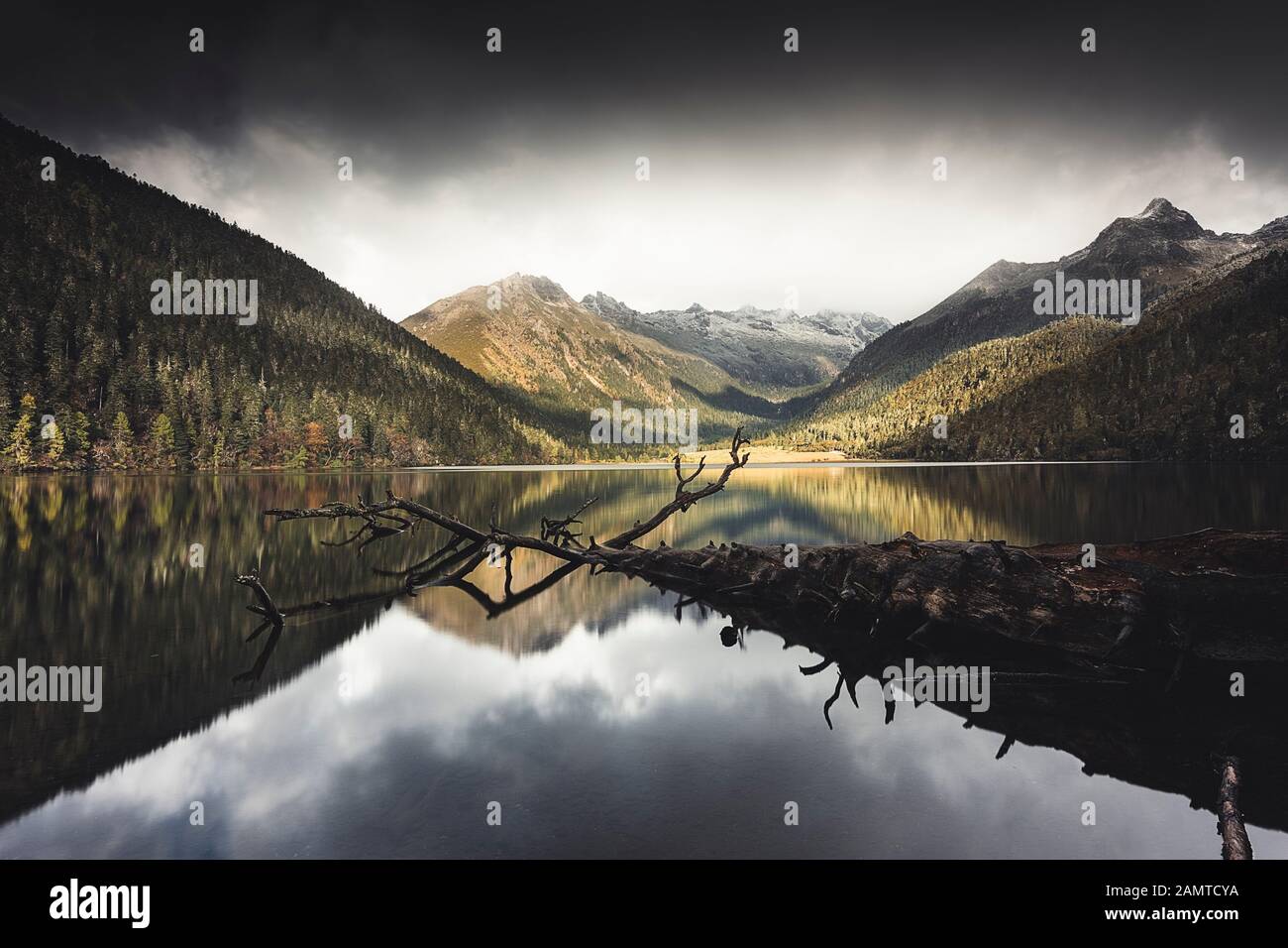Mountain reflections in Wuxu Hai Lake, Jiulong County, Sichuan, China ...