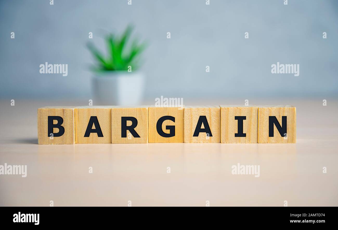 Text bargain on wooden cubes blue background. business concept Stock ...