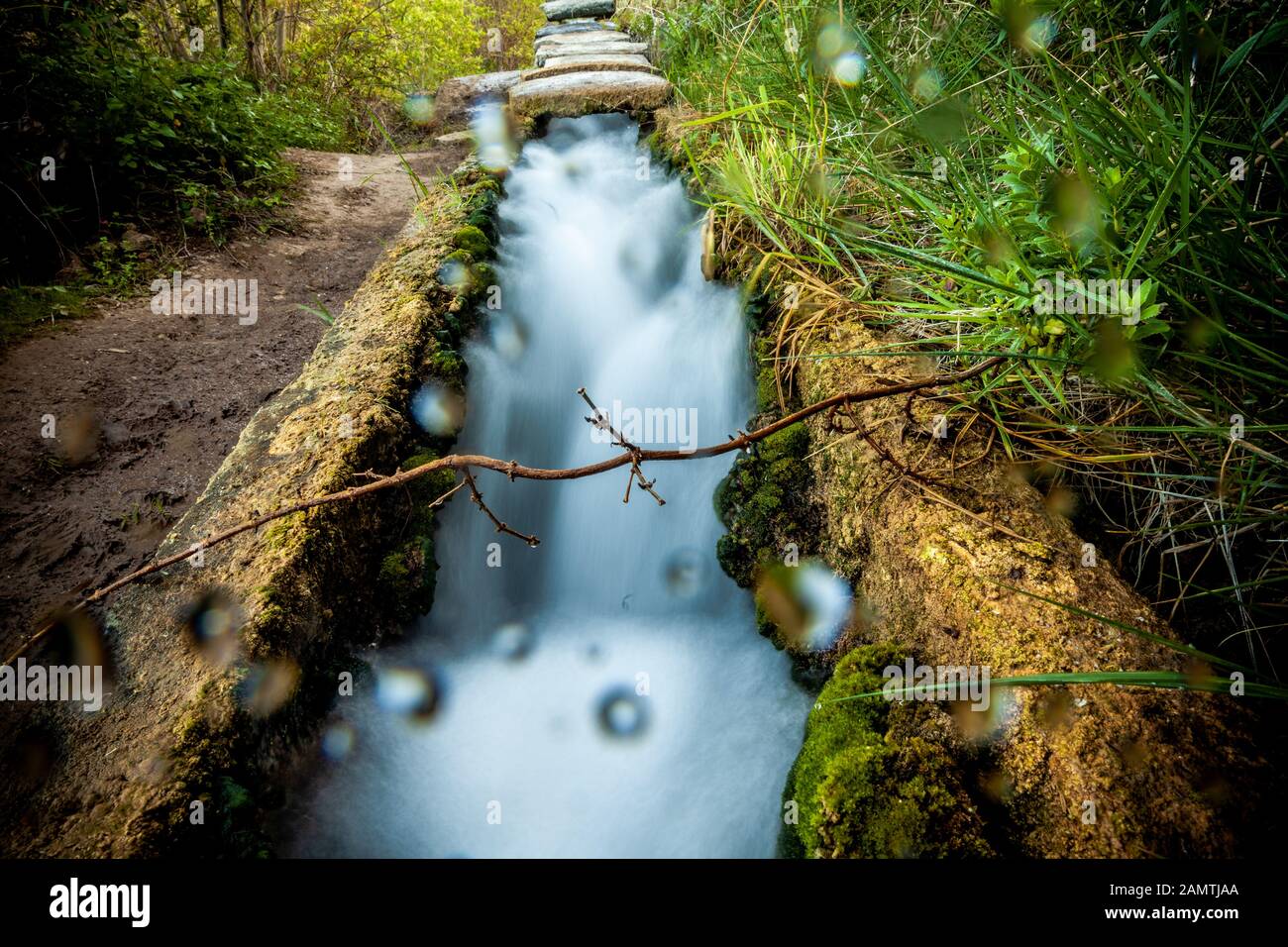 stone water channel full of running water in Tierra del Trigo village ...