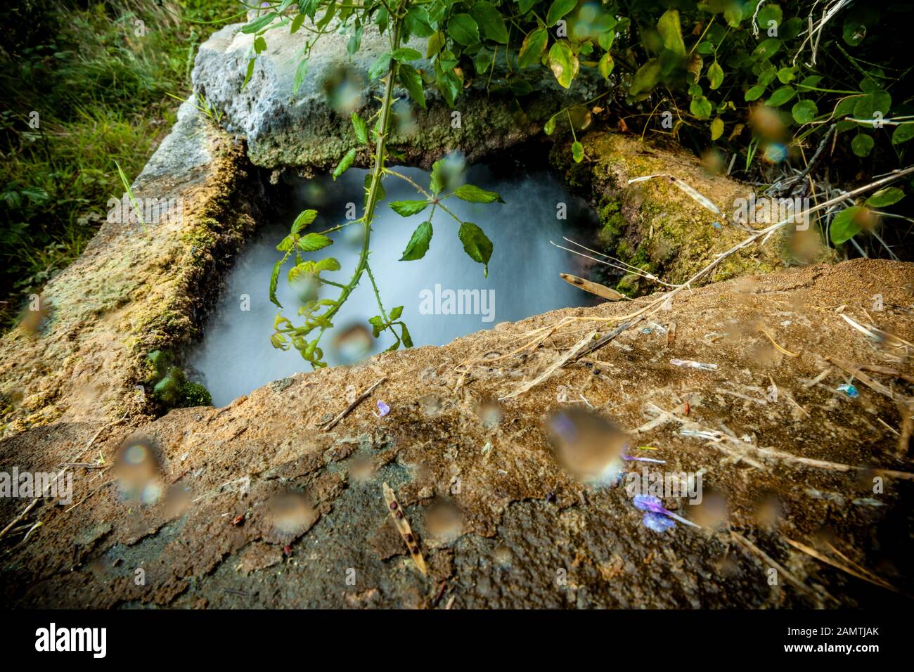 stone water channel full of running water in Tierra del Trigo village ...
