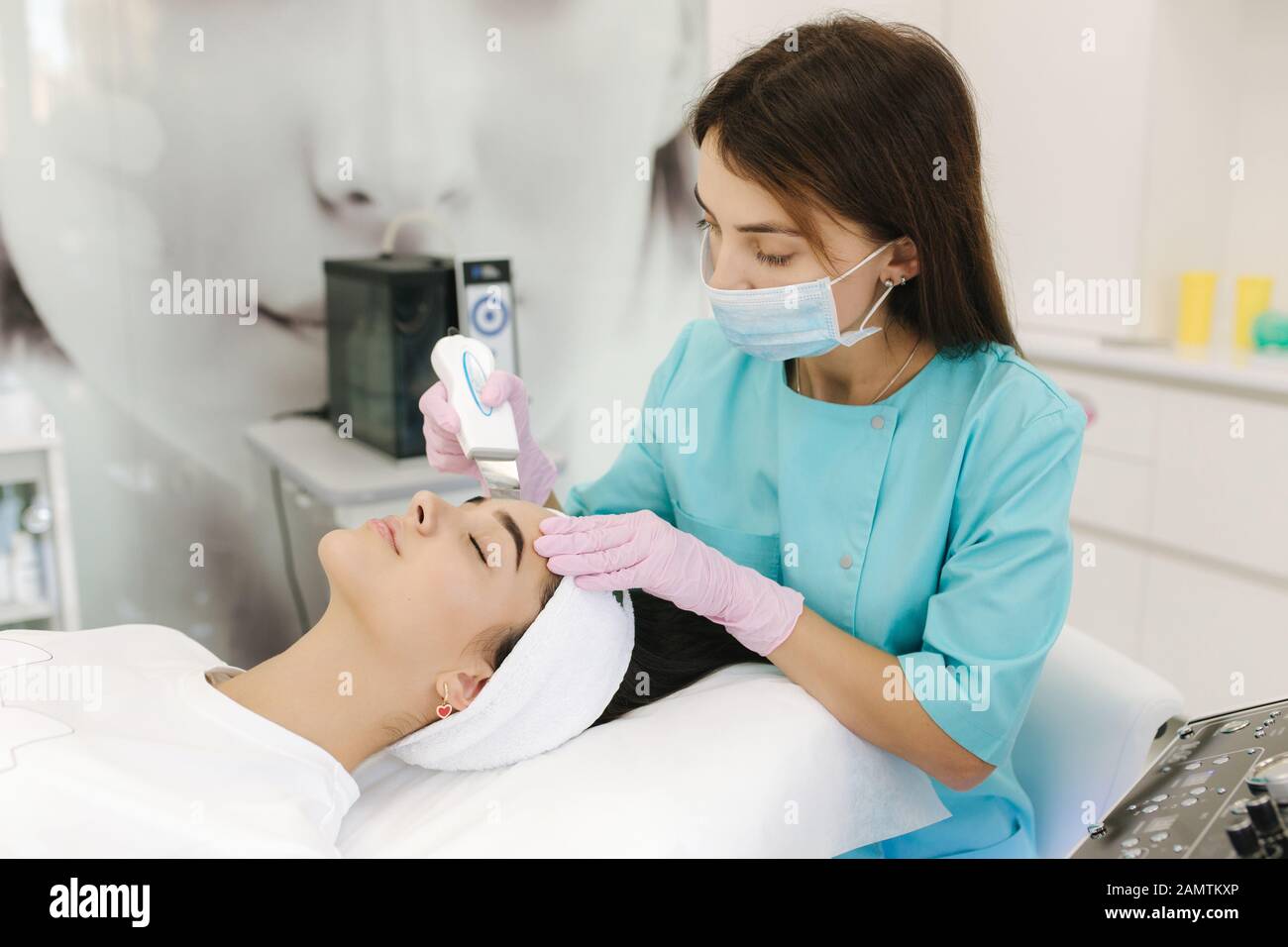 Young woman taking beauty procedure in spa salon Stock Photo - Alamy