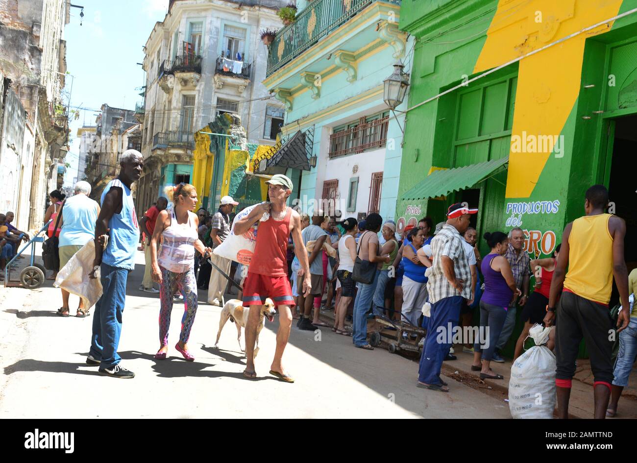 Cubans waiting in line to buy bread as part of ration program by the ...