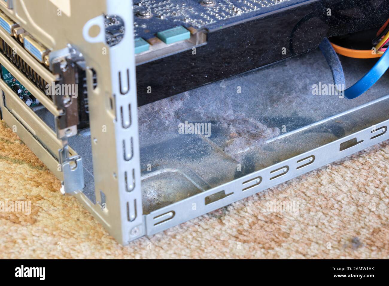Dust and hair inside an untidy computer case Stock Photo - Alamy